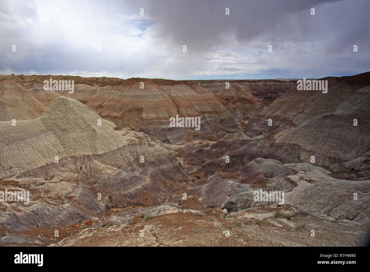 Badlands of the Painted Desert under a gathering rain storm in ...