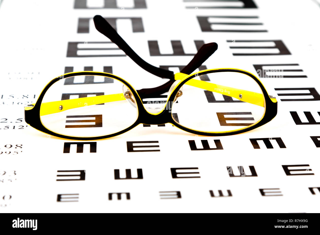 Glasses on vision test chart Stock Photo - Alamy