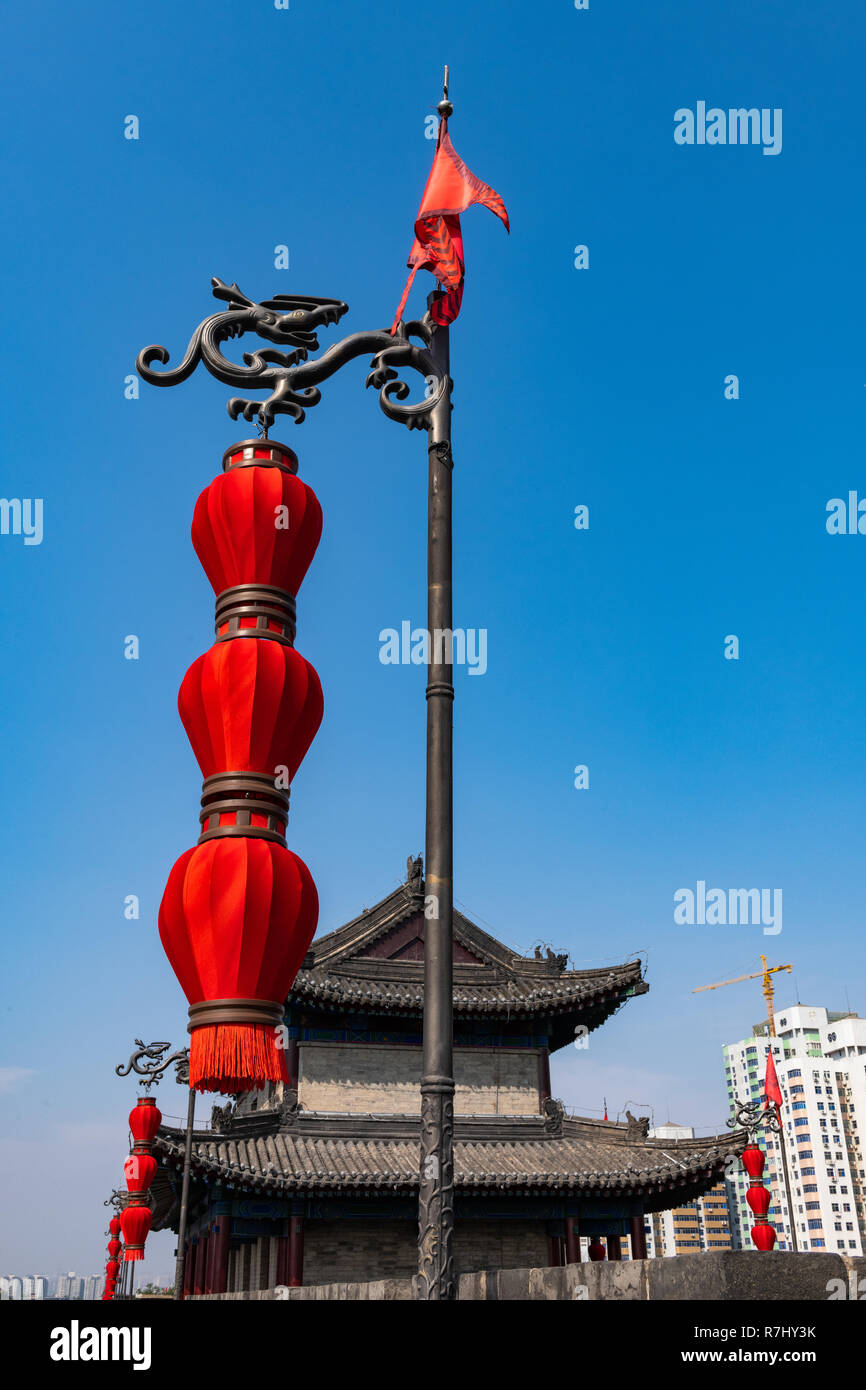 Banner-flag pole on Xian city wall with red lanterns and red flags ...