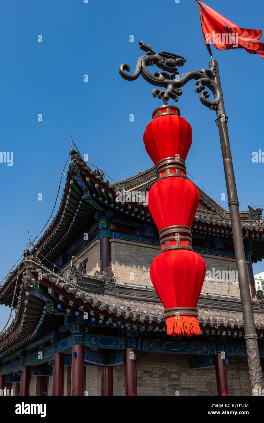Banner-flag pole on Xian city wall with red lanterns and red flags ...