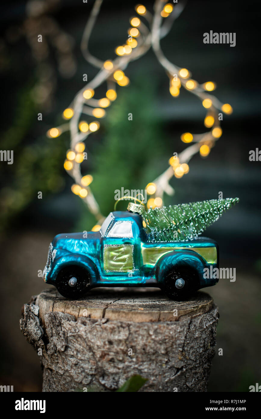 Car with christmas tree on stump Stock Photo - Alamy
