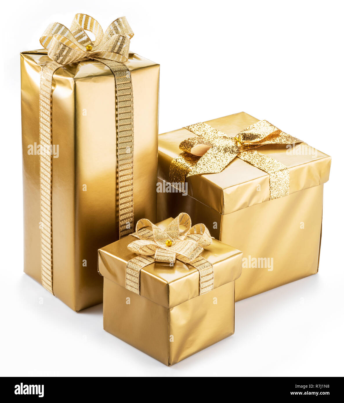 Golden gift boxes as a symbol of wishes and celebration on white ...