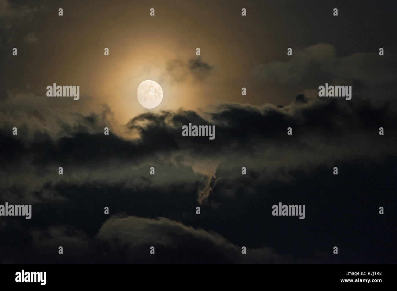 Moon between clouds hi-res stock photography and images - Alamy