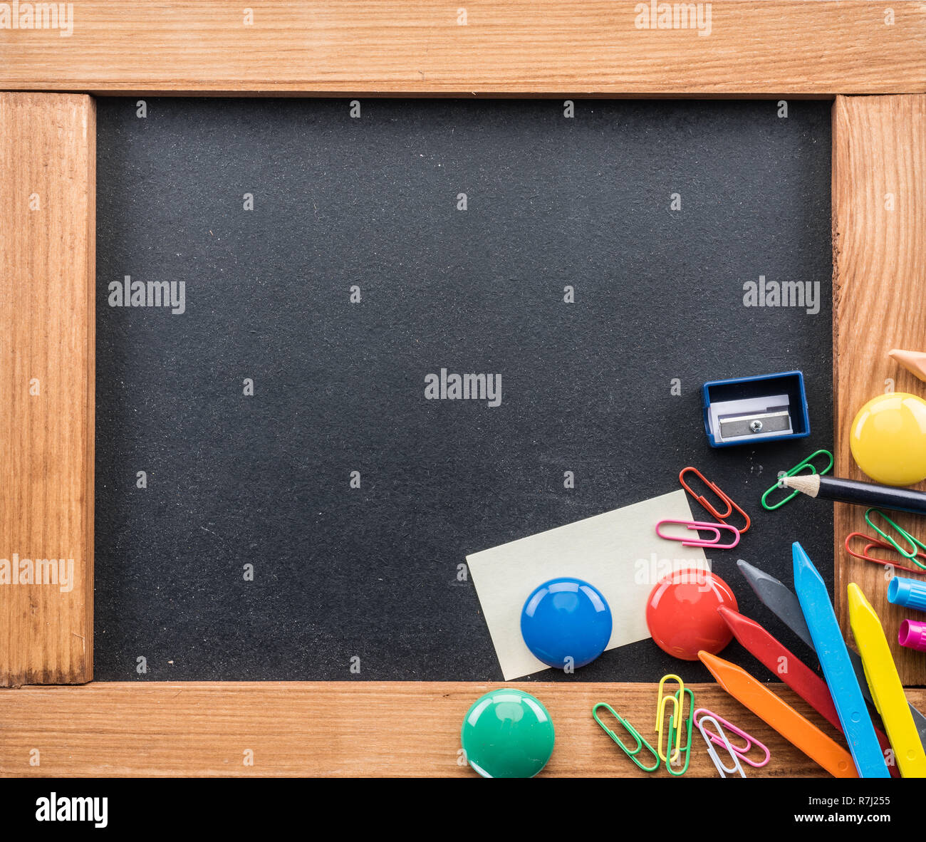 Blackboard and different school things. Close up Stock Photo - Alamy
