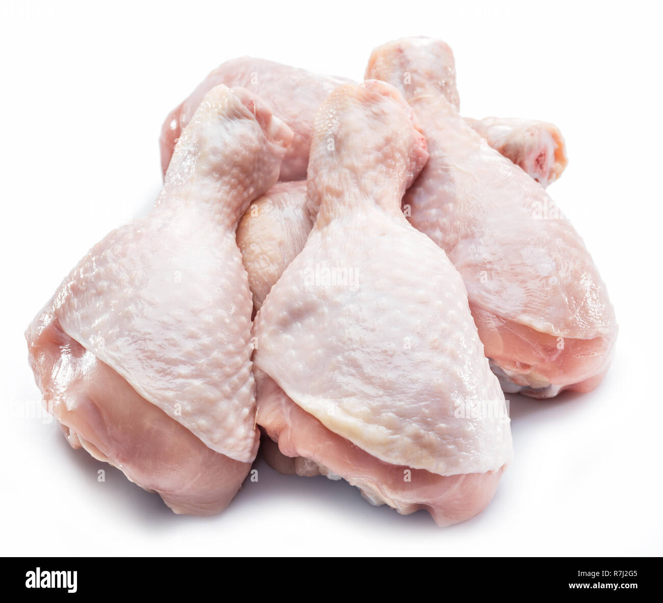 Raw chicken legs isolated on white background Stock Photo - Alamy