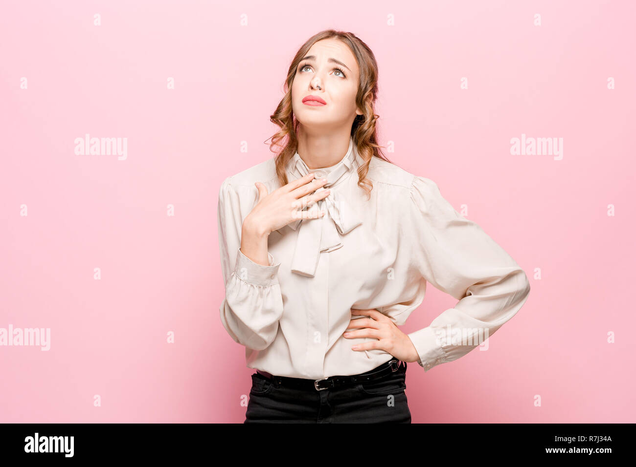 Serious unhappy female has appealing appearance, being sad after ...