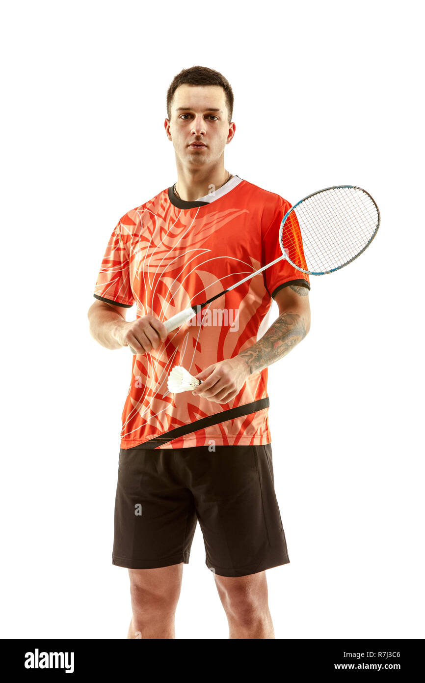 Young man badminton player standing over white studio background. Fit ...