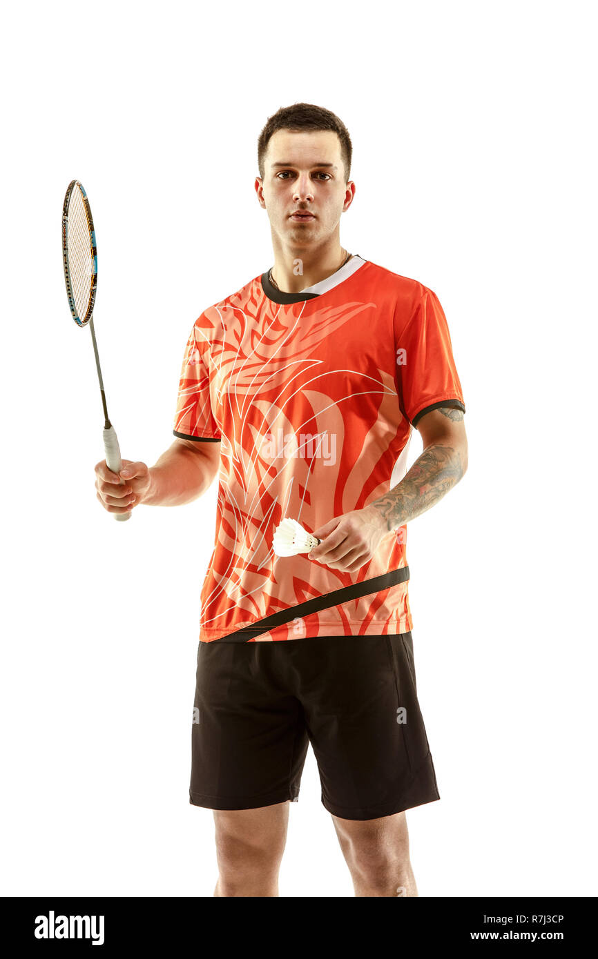 Young man badminton player standing over white studio background. Fit ...