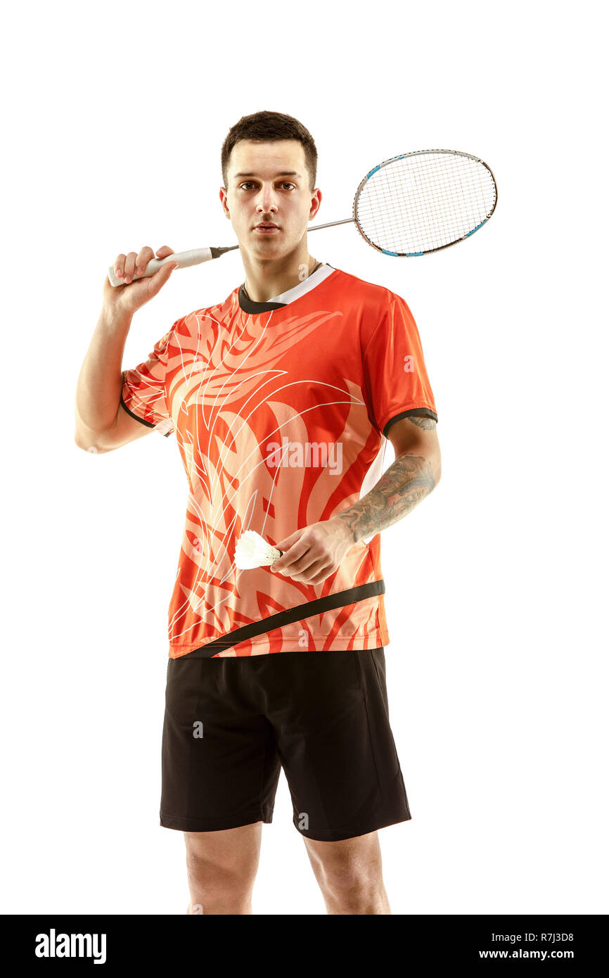 Young man badminton player standing over white studio background. Fit ...