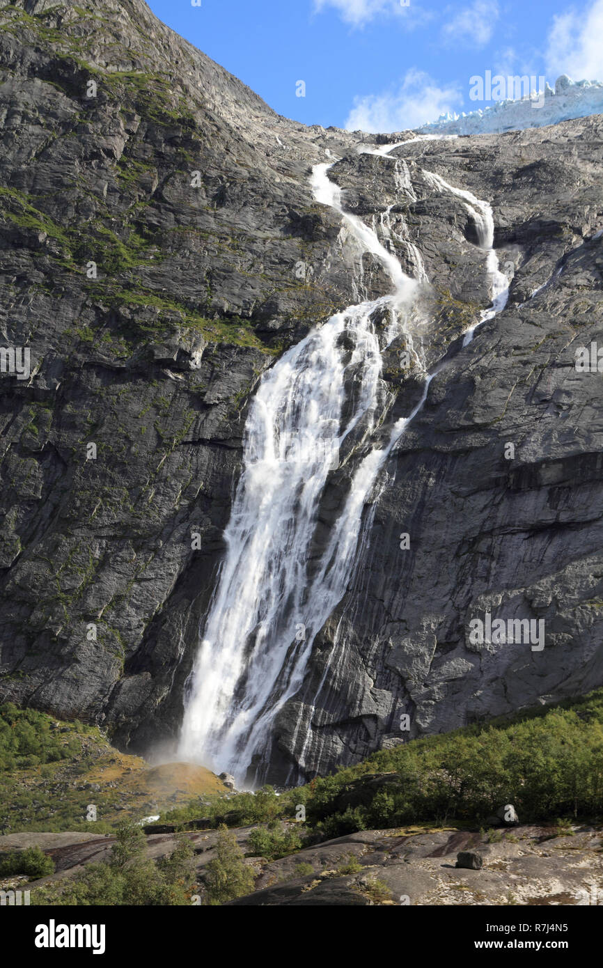 Norway, Jostedalsbreen National Park. Waterfall originating from ...