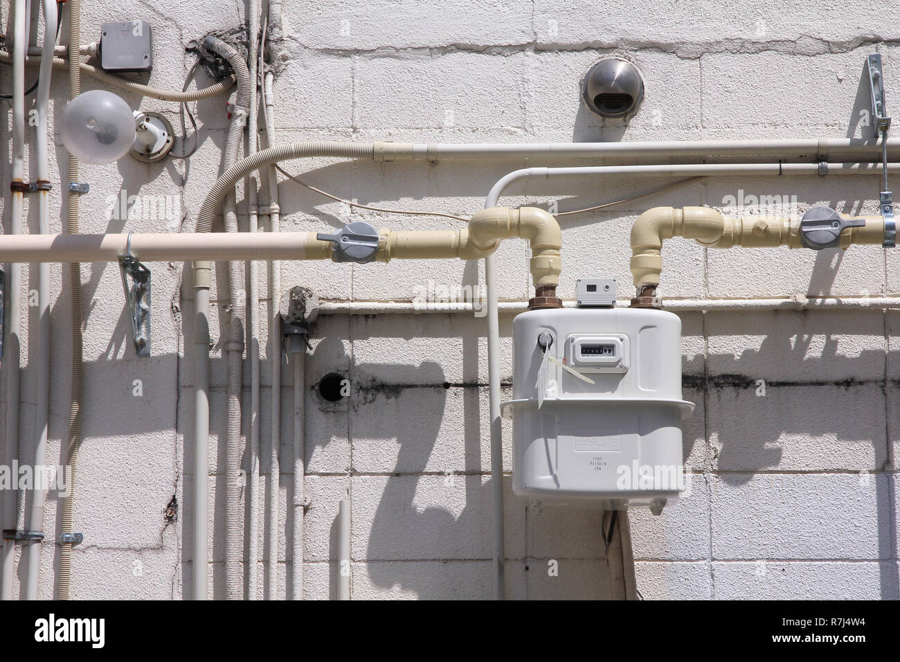 Natural gas meter and electric cables - typical building installations ...