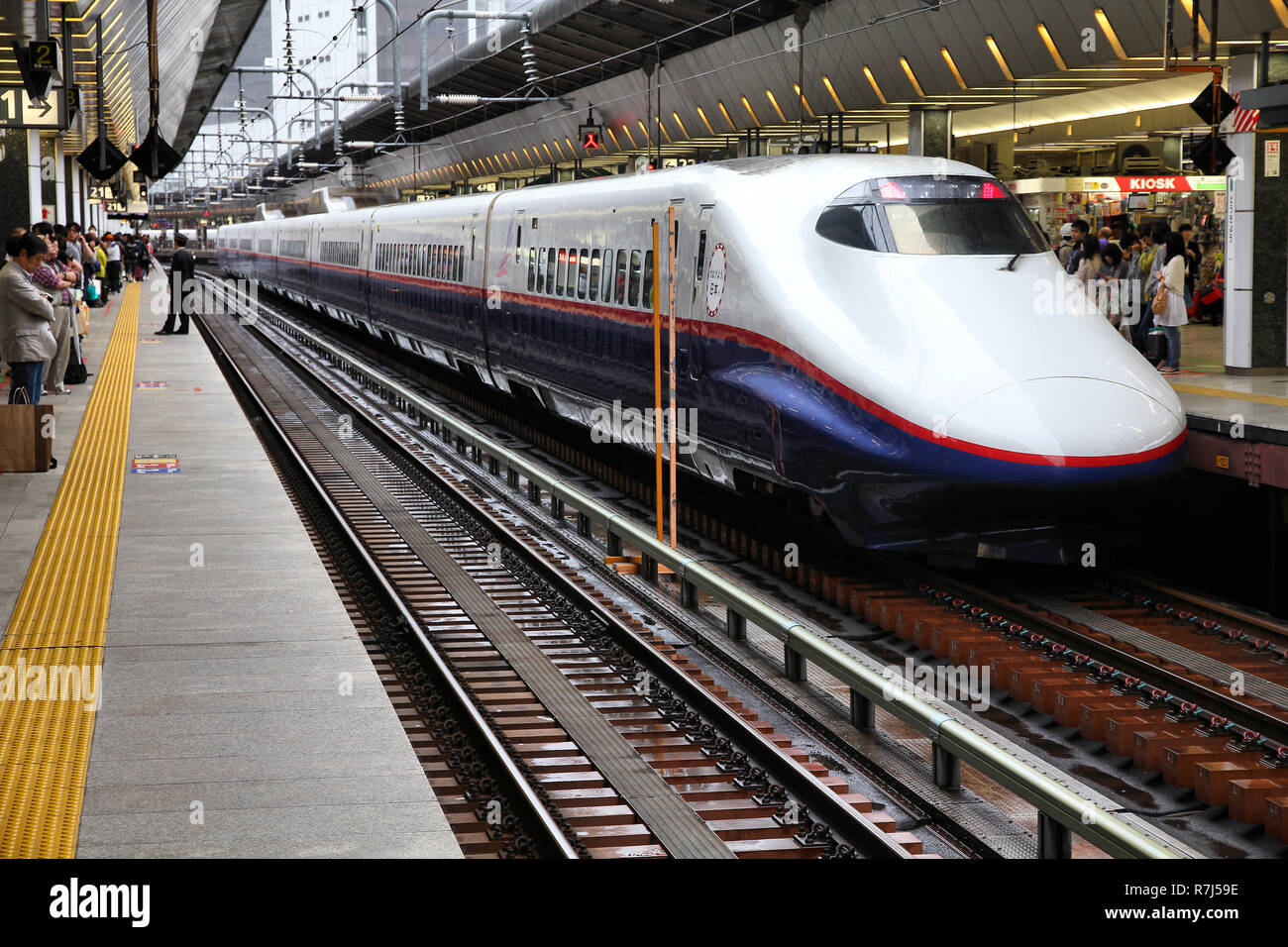 TOKYO - MAY 4: Travelers board Shinkansen Hayate train on May 4, 2012 ...