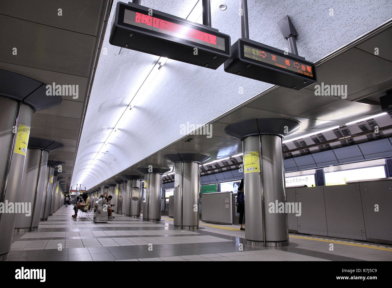 OSAKA, JAPAN - APRIL 25: People wait at Osaka Subway station on April ...