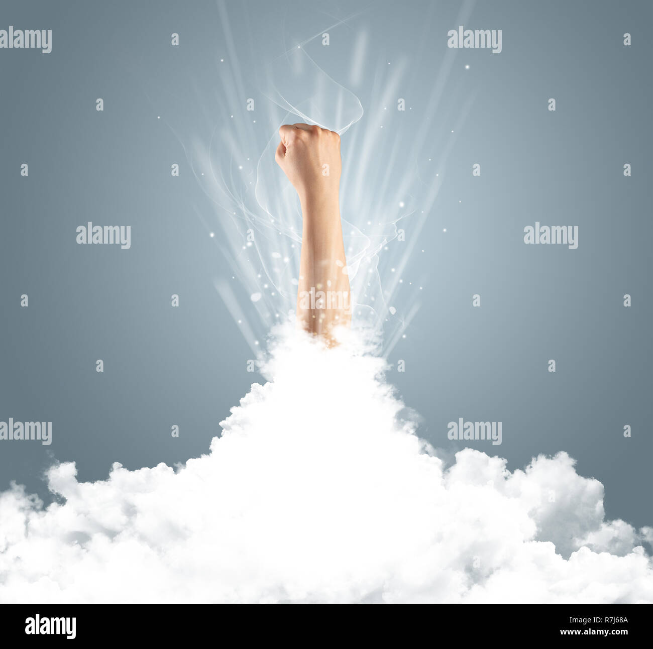 Hand breaking out from cloud Stock Photo - Alamy