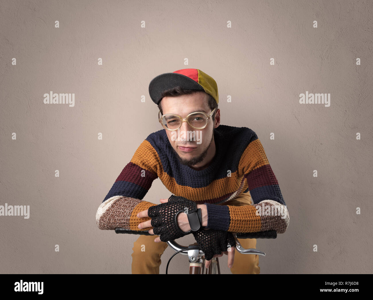 Nerd young foolish biker on a bike with oldschool outfit Stock Photo ...