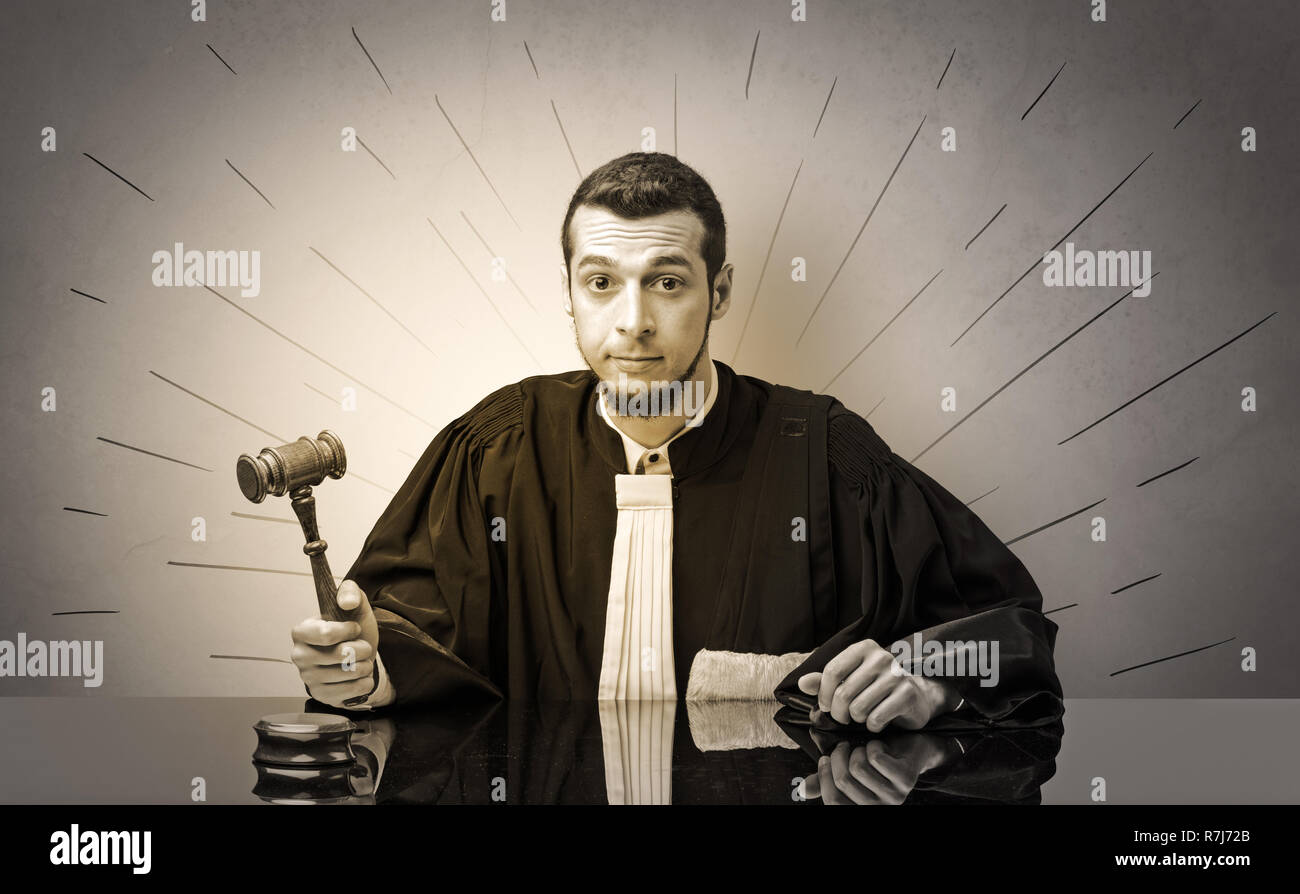 Young dashing judge in black gown making decision Stock Photo - Alamy
