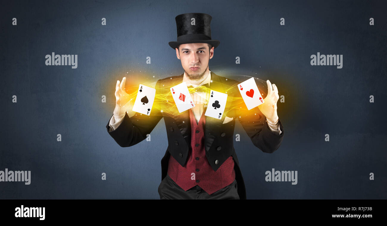 Illusionist in tails bandy play cards between his two hands Stock Photo ...
