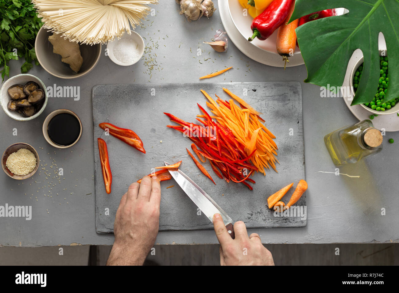 Top view man cooking vegetarian thai noodles in home cooking top view ...