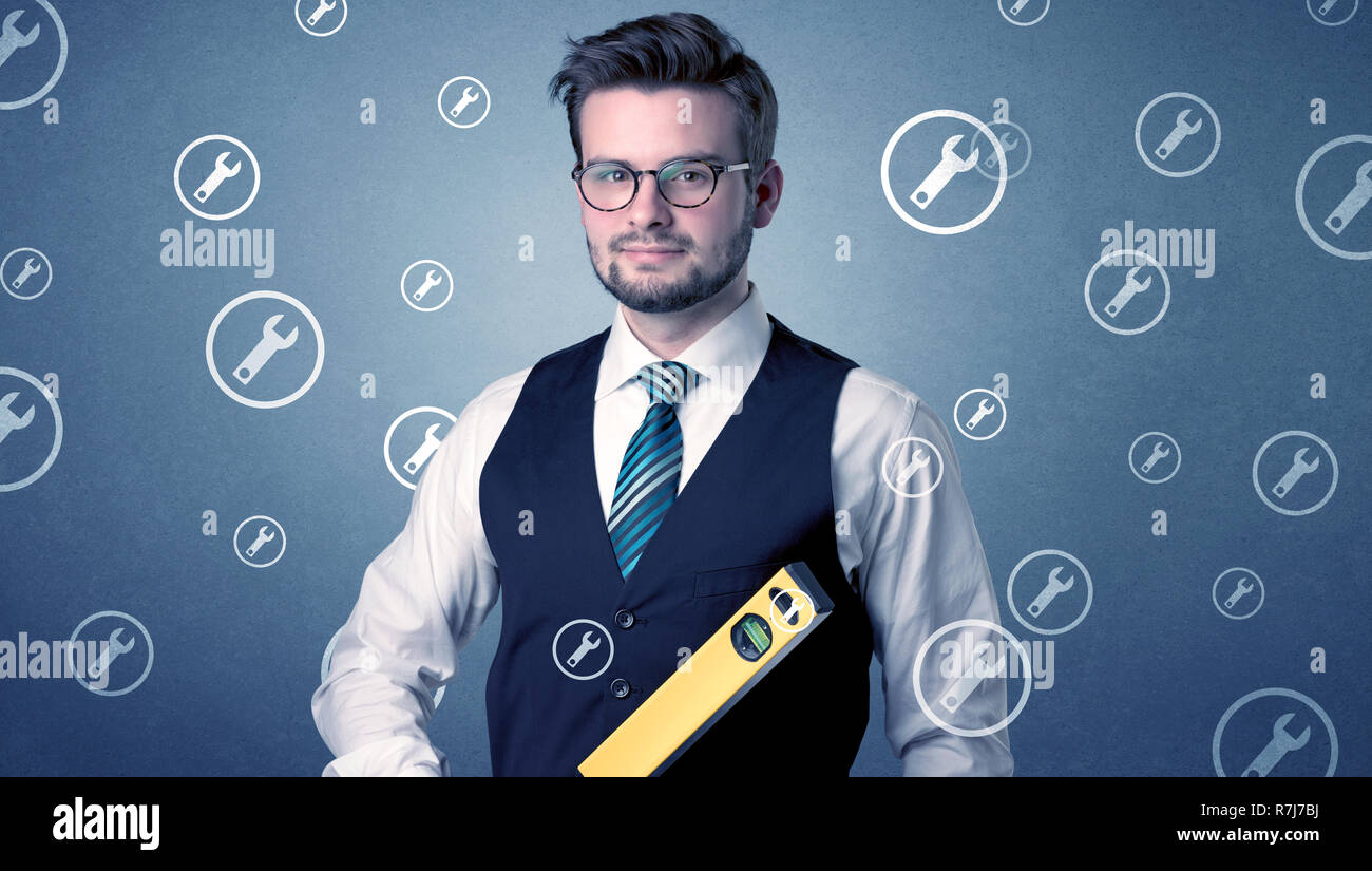 Serious handyman holding hammer hi-res stock photography and images - Alamy