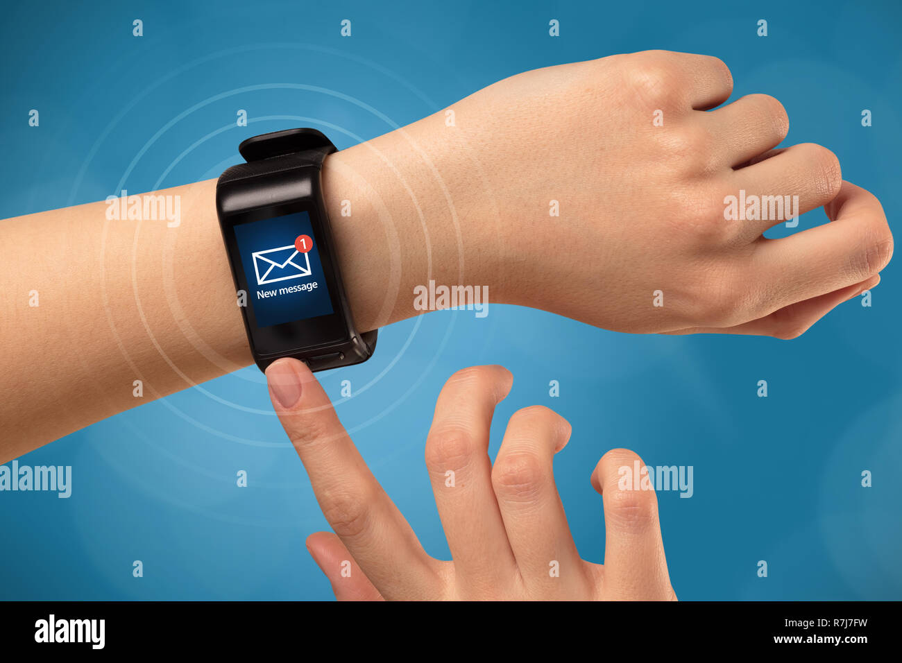 Female hand receives new message on her smartwatch Stock Photo - Alamy