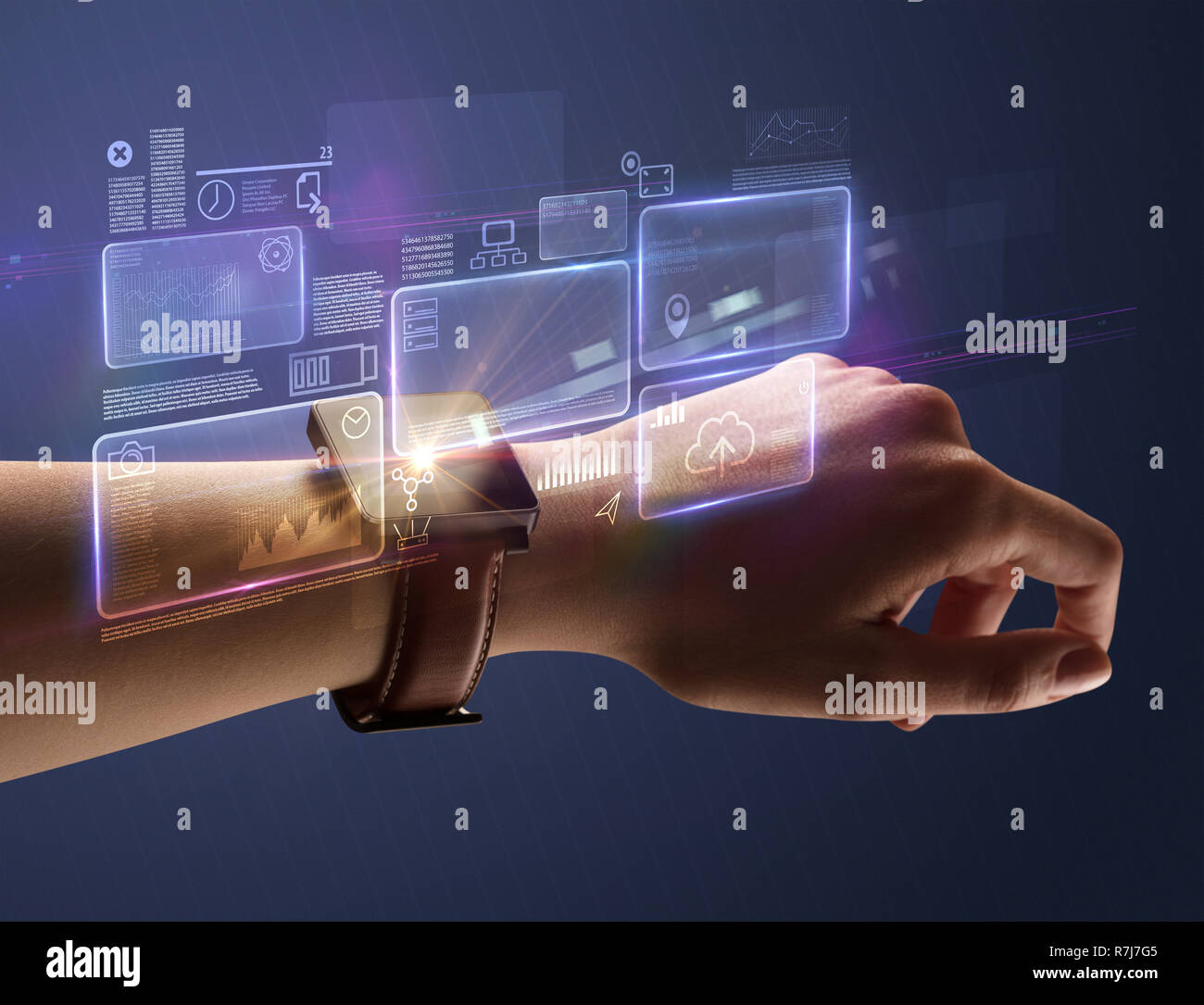 Female hand wearing smartwatch with statement labels around and dark ...