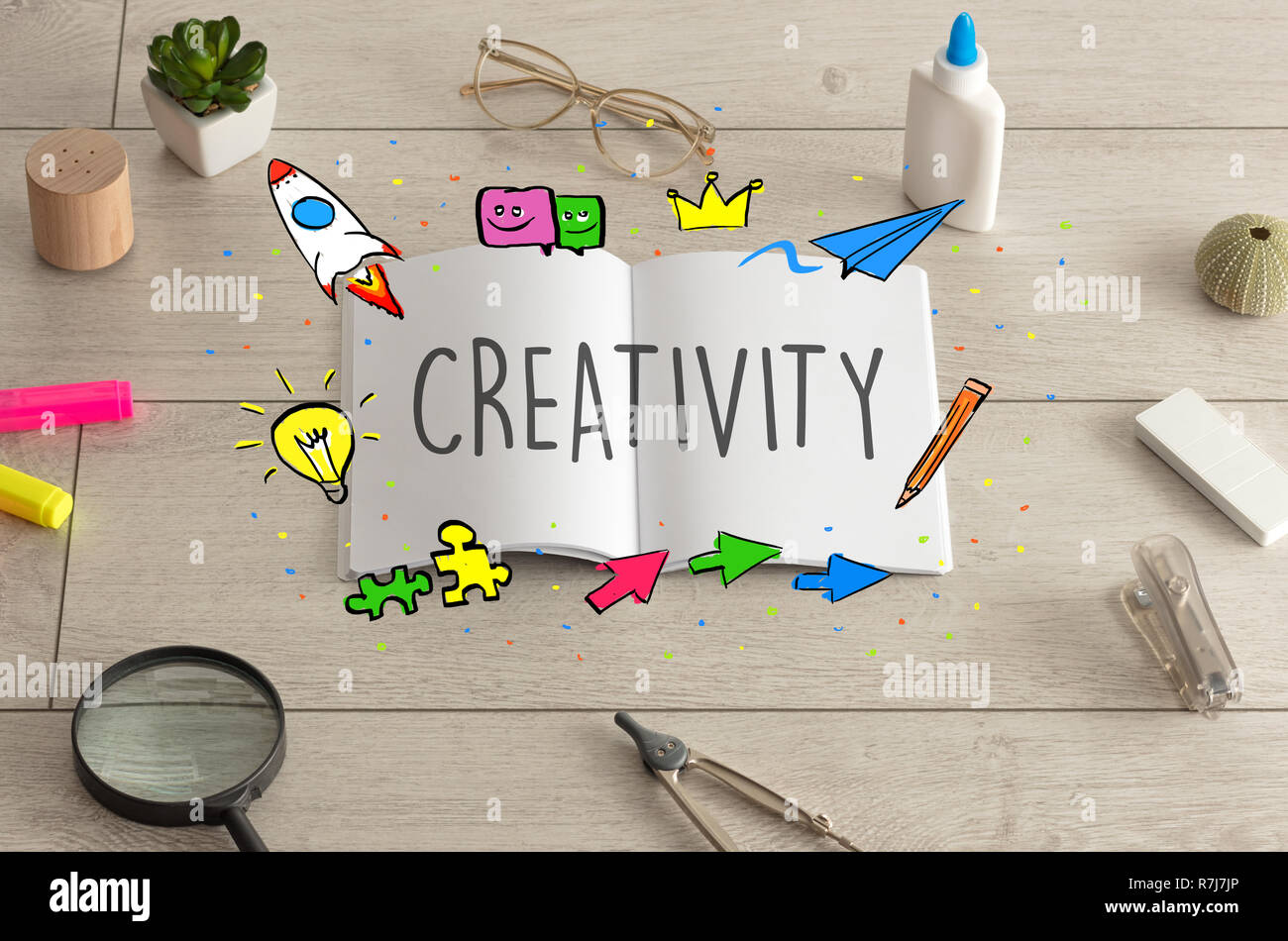 Open notebook on the floor with instruments on the floor and creativity ...