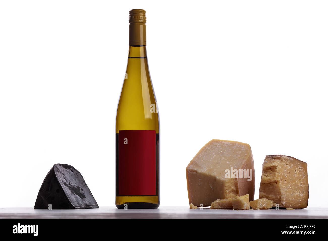 A bottle of white wine, expensive cheese, musty cheese, black cheese ...