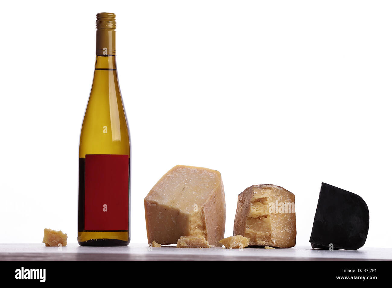 A bottle of white wine, expensive cheese, musty cheese, black cheese ...