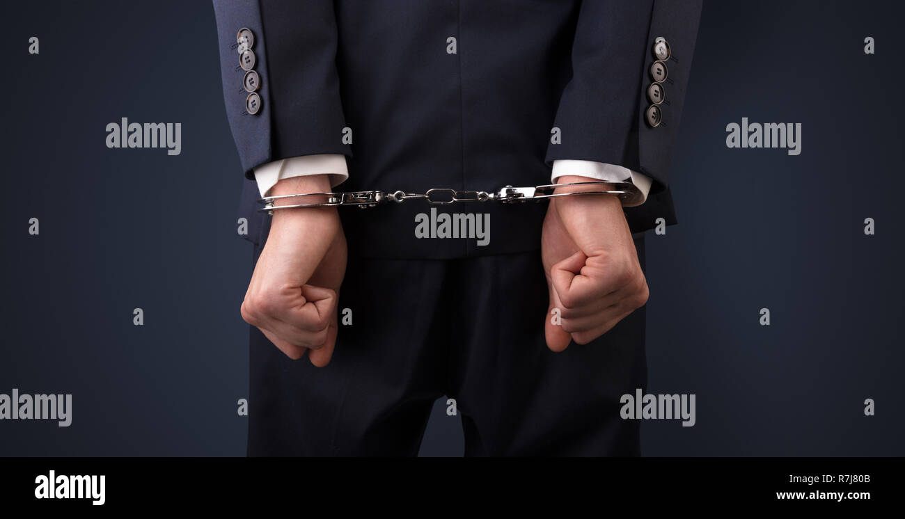 Close now arrested men hand with dark background and handcuffs Stock ...
