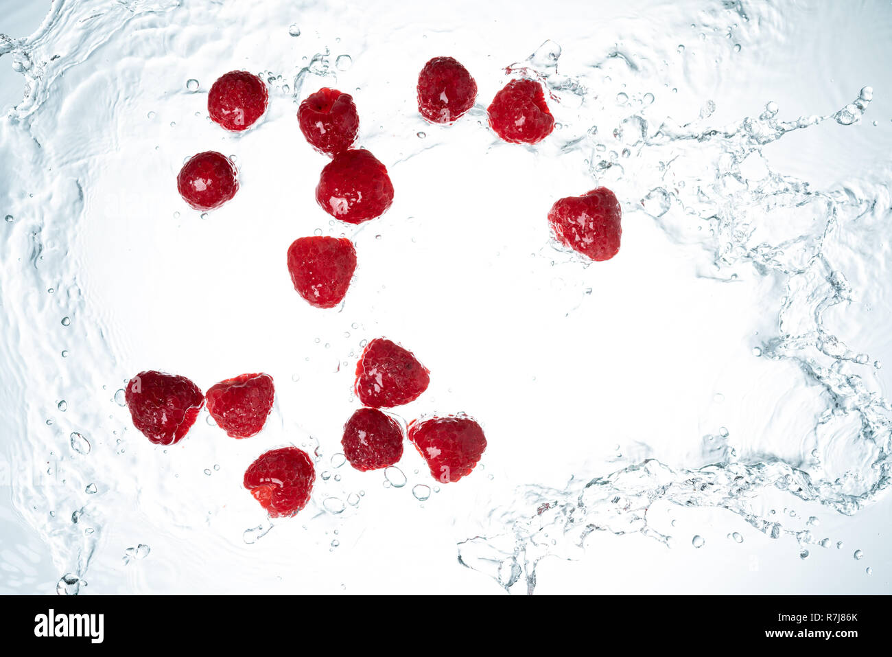 Raspberries water splashing hi-res stock photography and images - Alamy