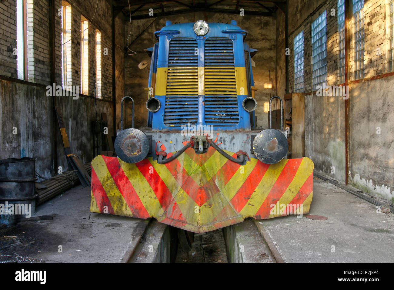 Old abandoned diesel locomotive in a former factory Stock Photo - Alamy
