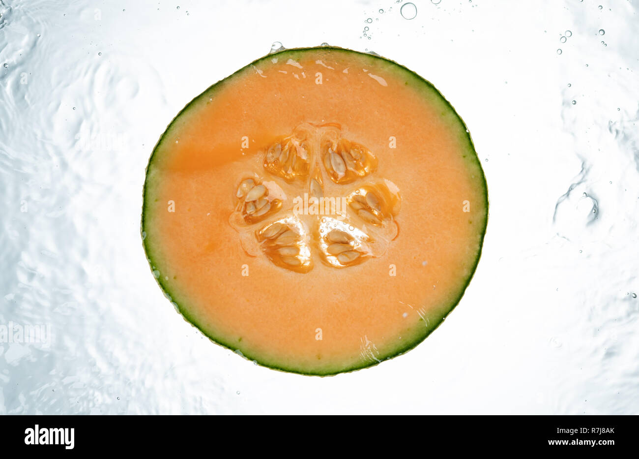 Melon Water Splash on white background Stock Photo - Alamy