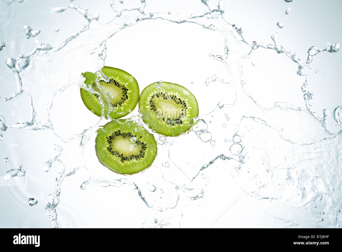 Kiwi Water Splash on White Background Stock Photo - Alamy