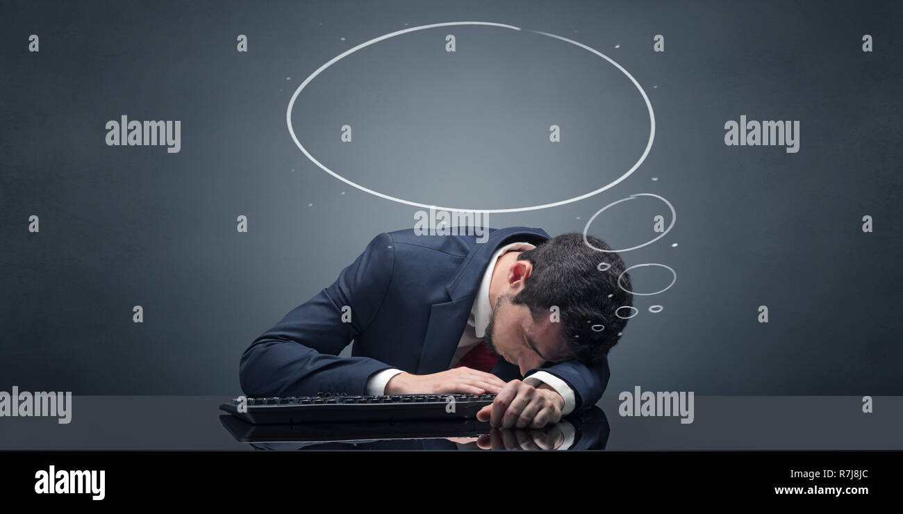 Young businessman sleeping and dreaming at the office Stock Photo - Alamy