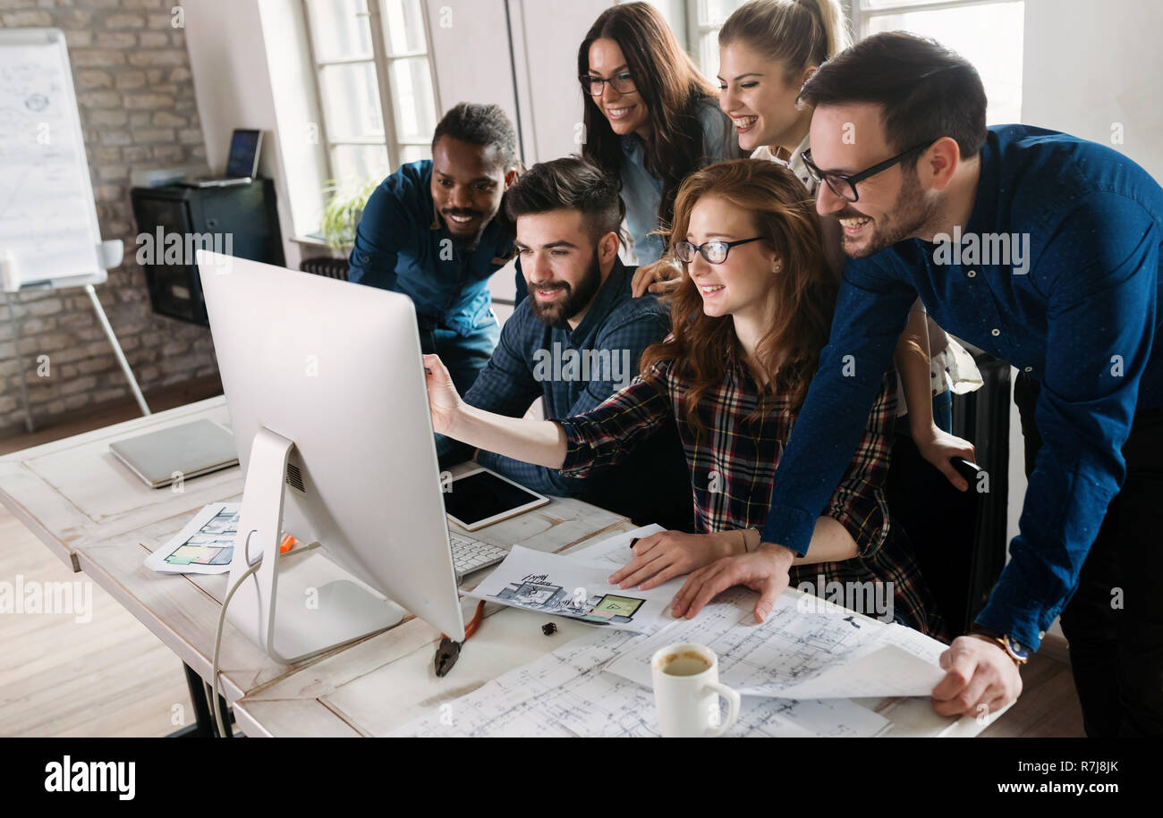 Picture of architects working together in office Stock Photo - Alamy