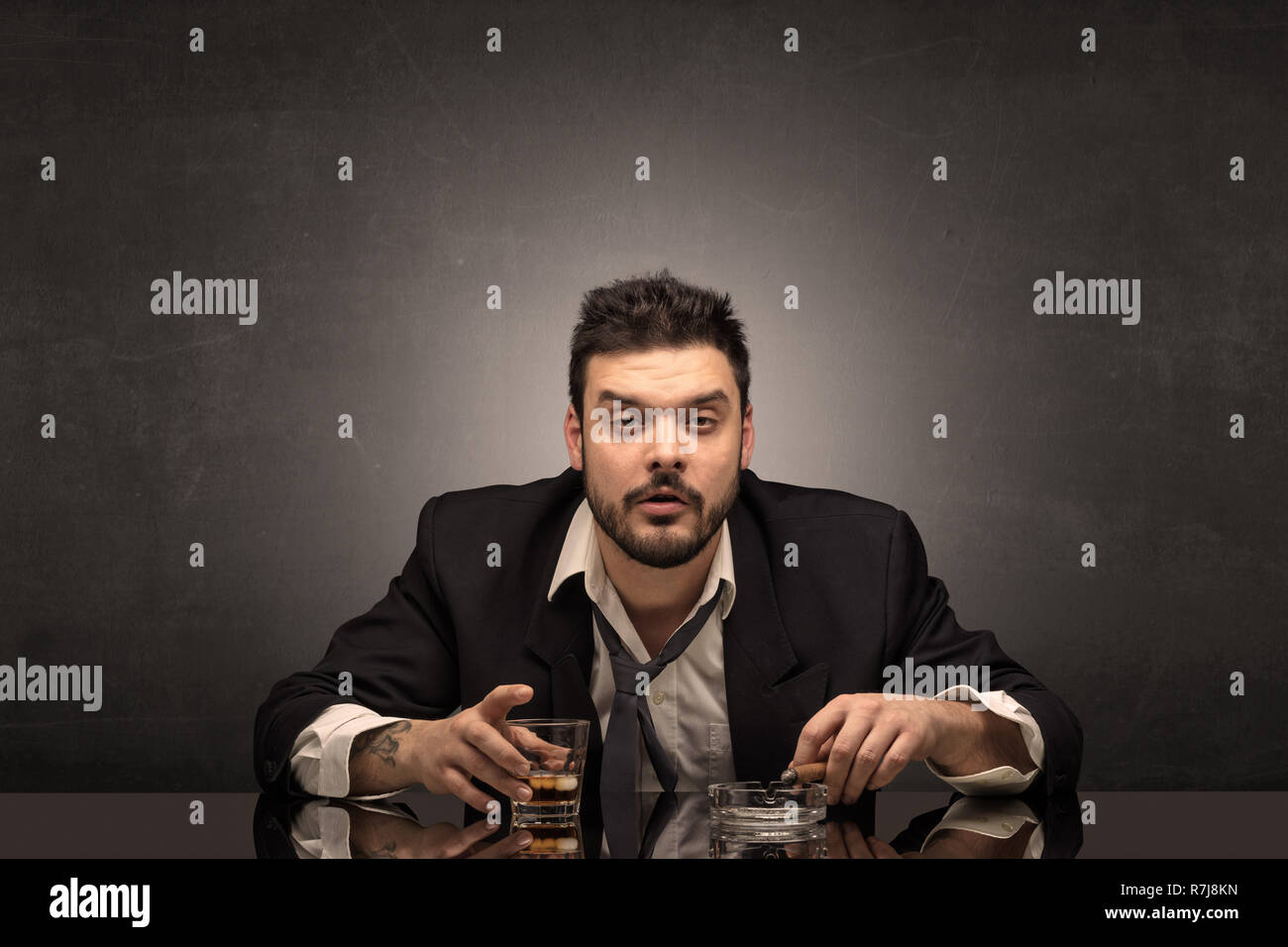 Young drunk man at his office with free dark copyspace Stock Photo - Alamy
