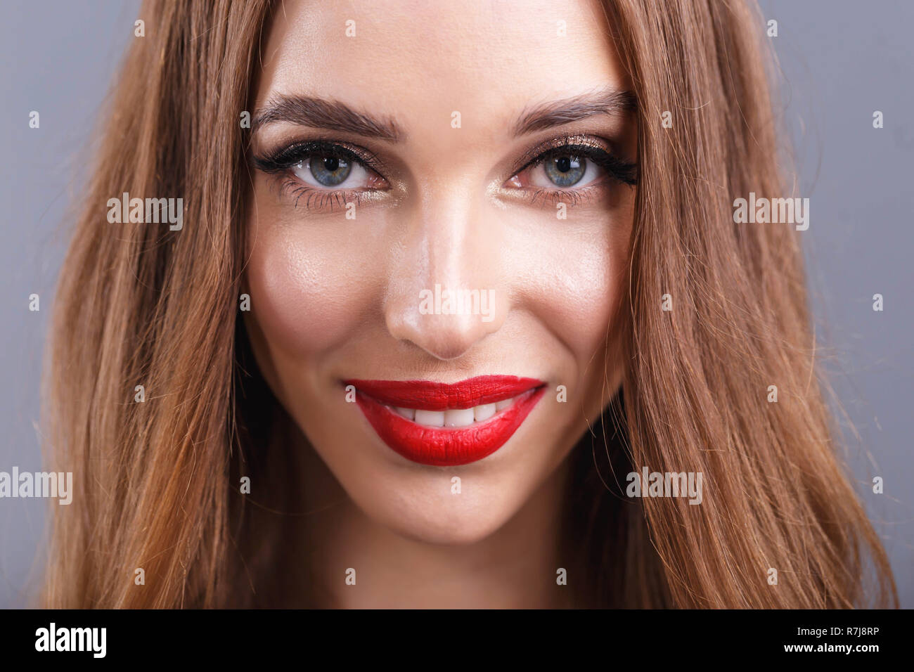 Portrait of attractive romantic long haired woman with red lips wearing ...