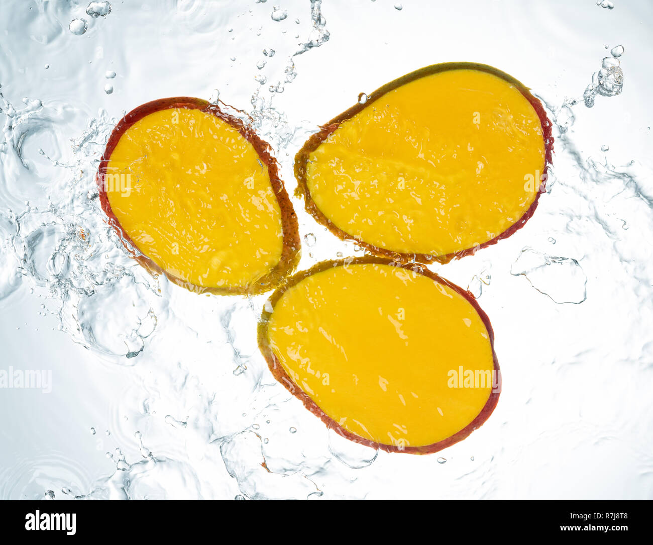 Mango Water Splash on white background Stock Photo - Alamy