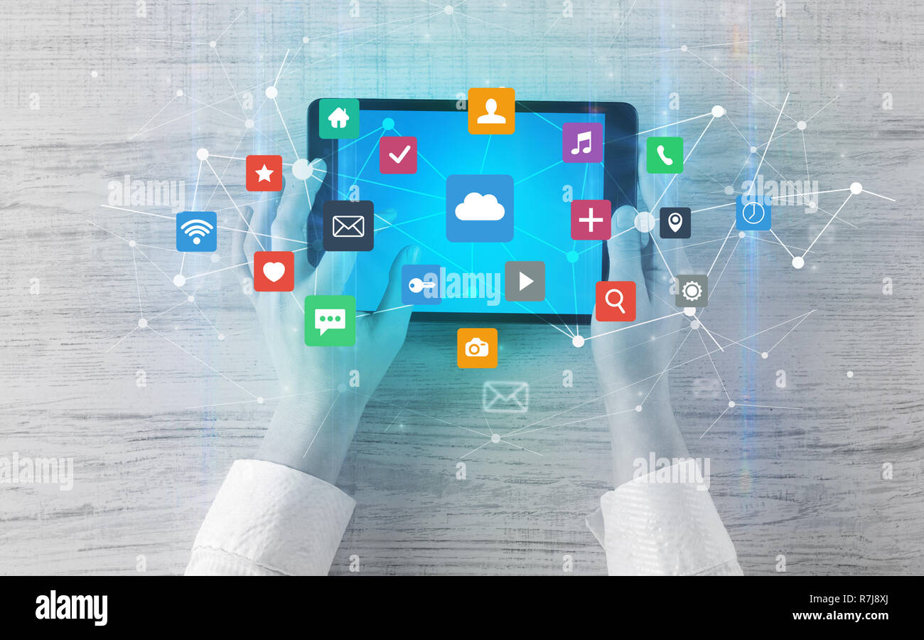 Hand touching multitask tablet with cloud wifi message social media ...