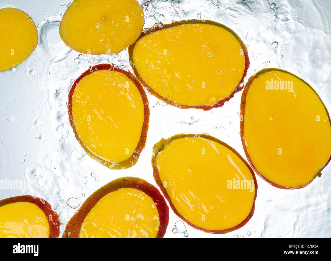 Mango Water Splash on white background Stock Photo - Alamy