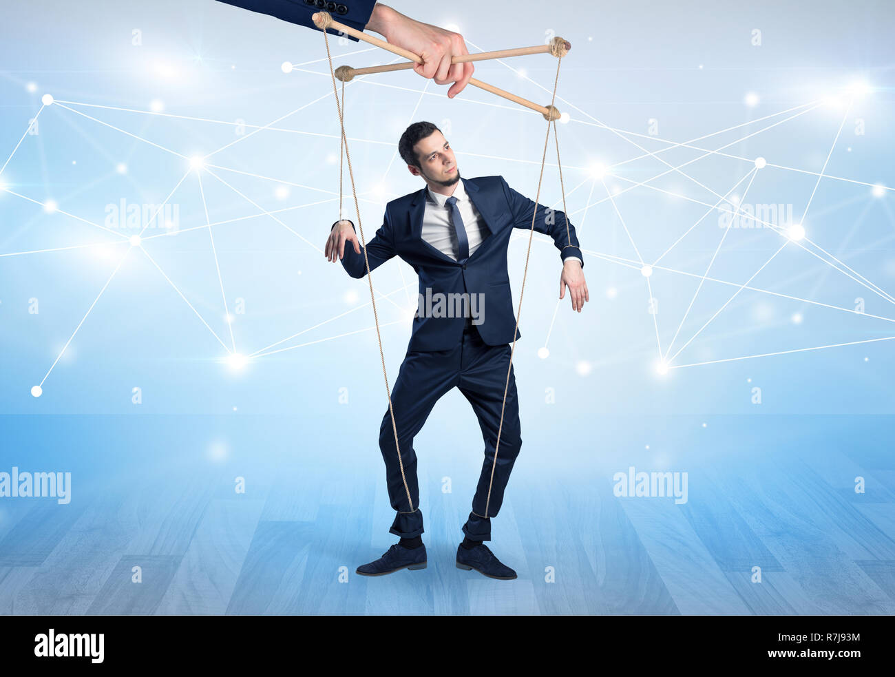 Puppet businessman controlled by another hand with financial concept ...