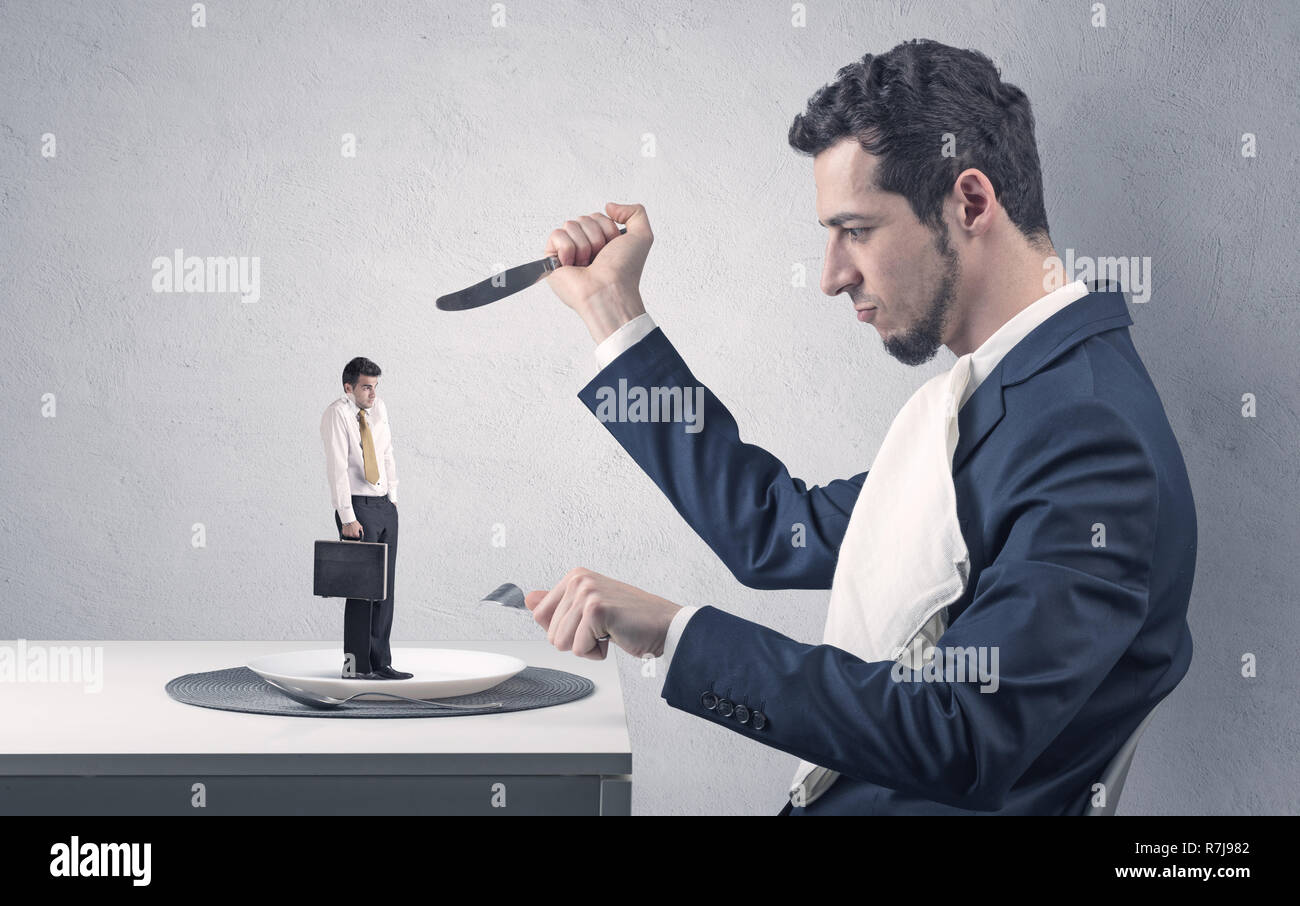 Tiny scared weak businessman almost devoured by great power Stock Photo ...