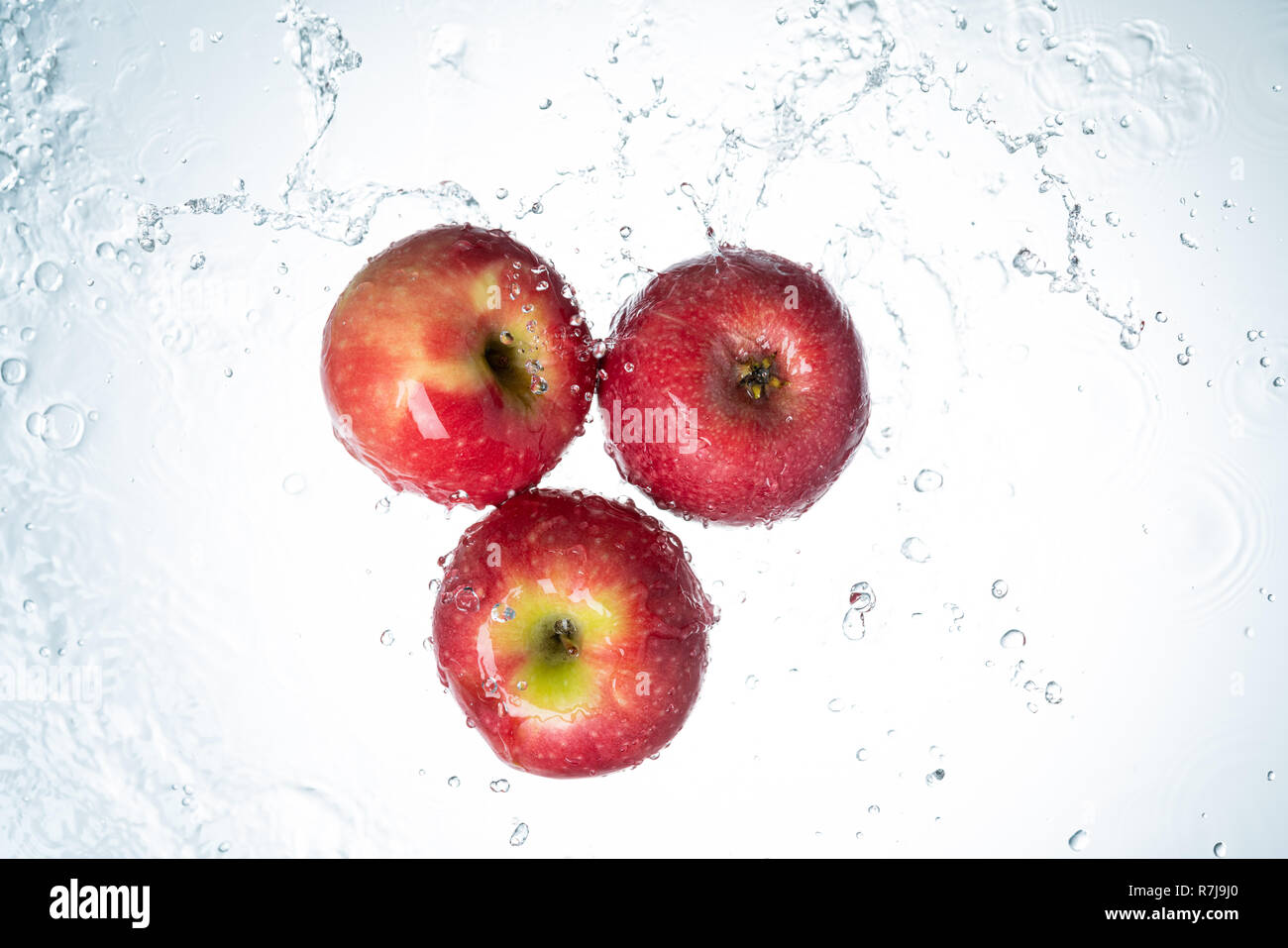 Apples Water Splash on White Background Stock Photo - Alamy