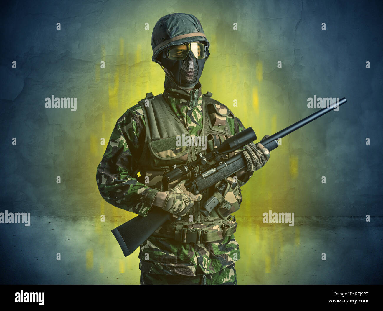 Hazard, menace soldier in a ruined crumbly building with arms on his ...