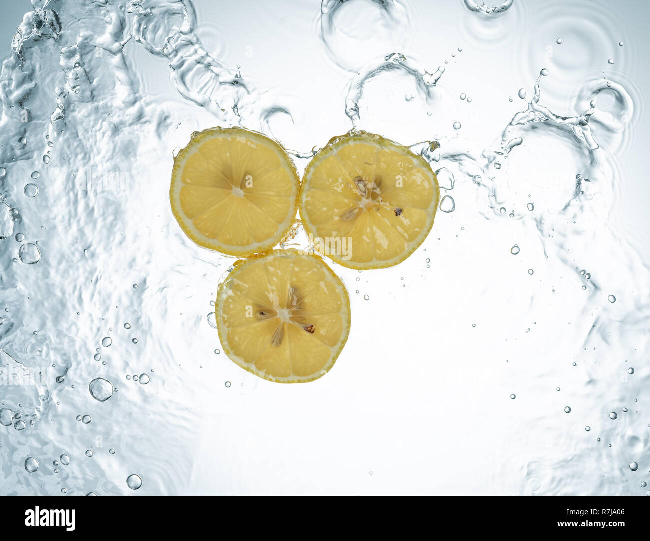 Lemons Water Splash on white background Stock Photo - Alamy