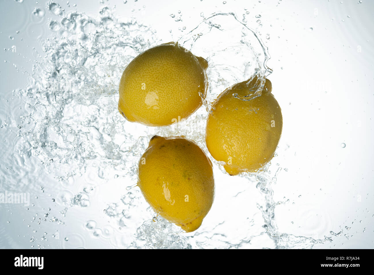 Lemons Water Splash on white background Stock Photo - Alamy