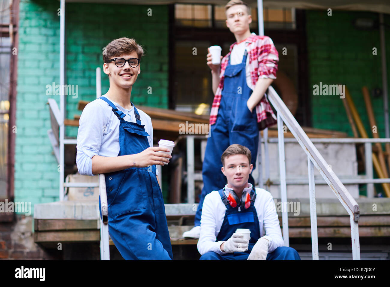 Cheerful handsome guys in workwear Stock Photo - Alamy