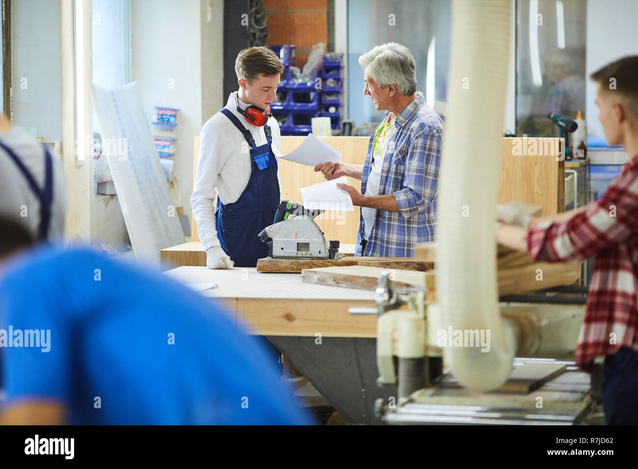 Irritated senior man yelling at inexperienced carpenter for mist Stock ...