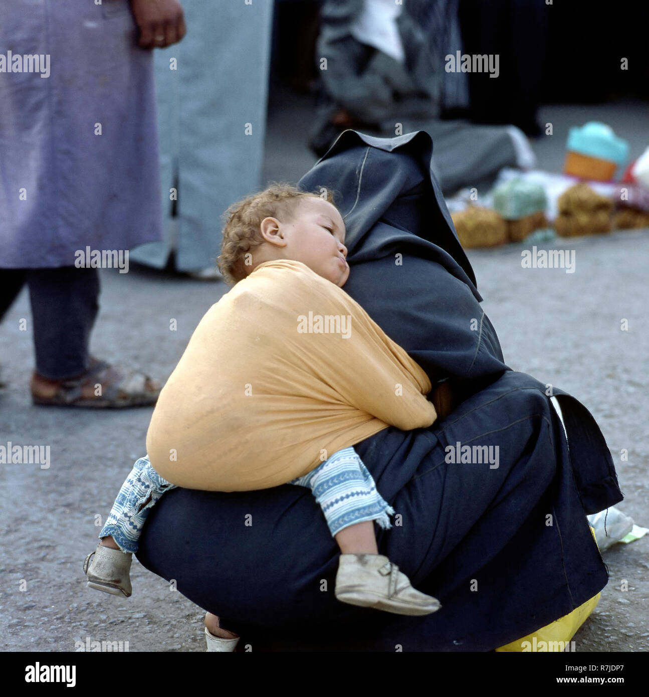 Baby sleeping on mothers back hi-res stock photography and images - Alamy
