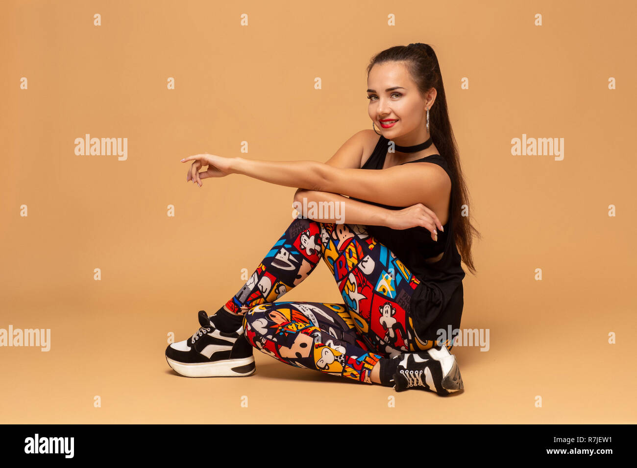 Young female dancer on studio background. Young modern style dancer ...